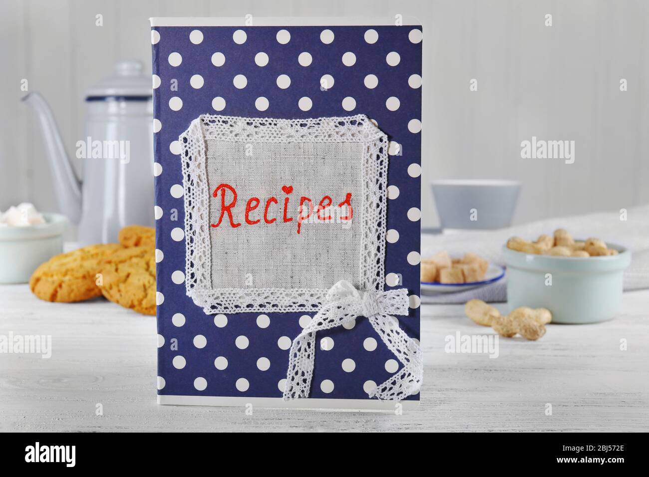 Recipe book on a table with ingredients for baking Stock Photo - Alamy