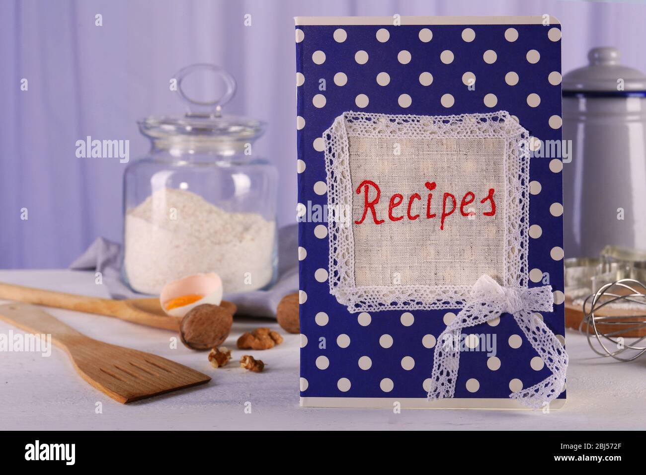 Recipe book on a table with ingredients for baking Stock Photo - Alamy