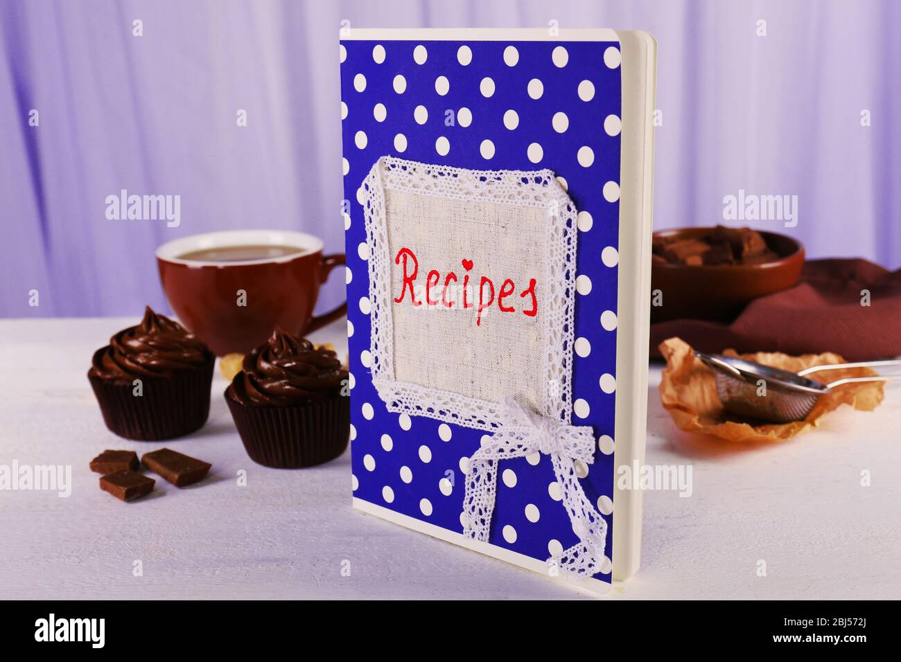 Recipe book on a table with ingredients for baking Stock Photo - Alamy