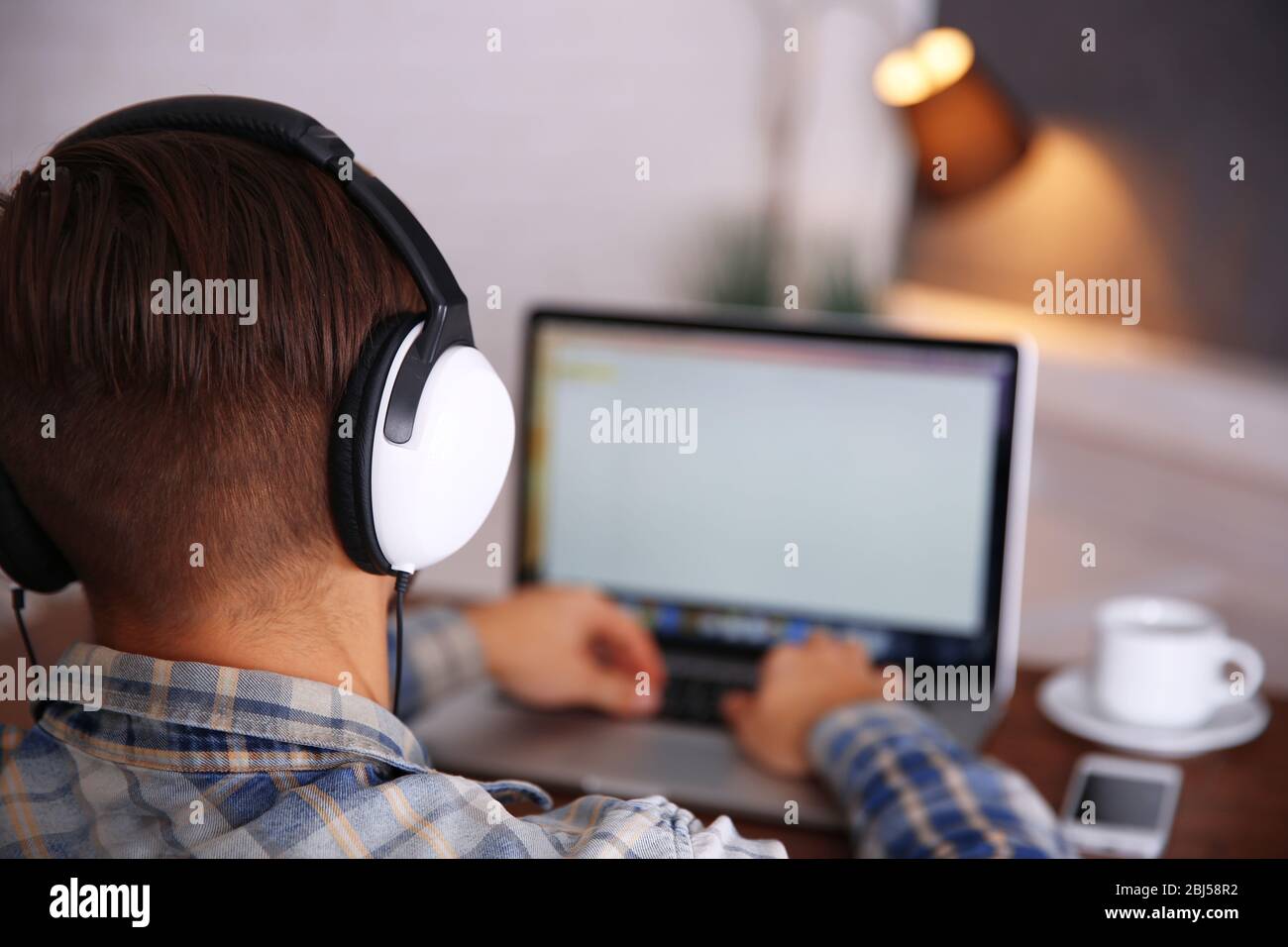 Young man playing computer game Stock Photo - Alamy