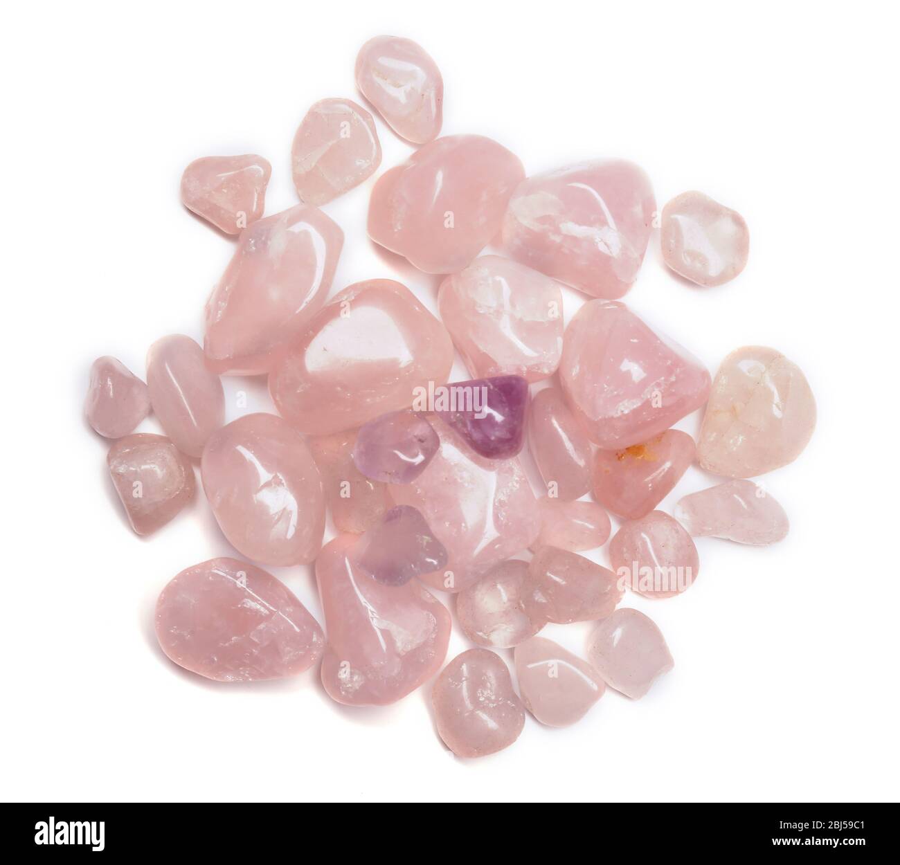 Pink quartz pile isolated on white background Stock Photo - Alamy