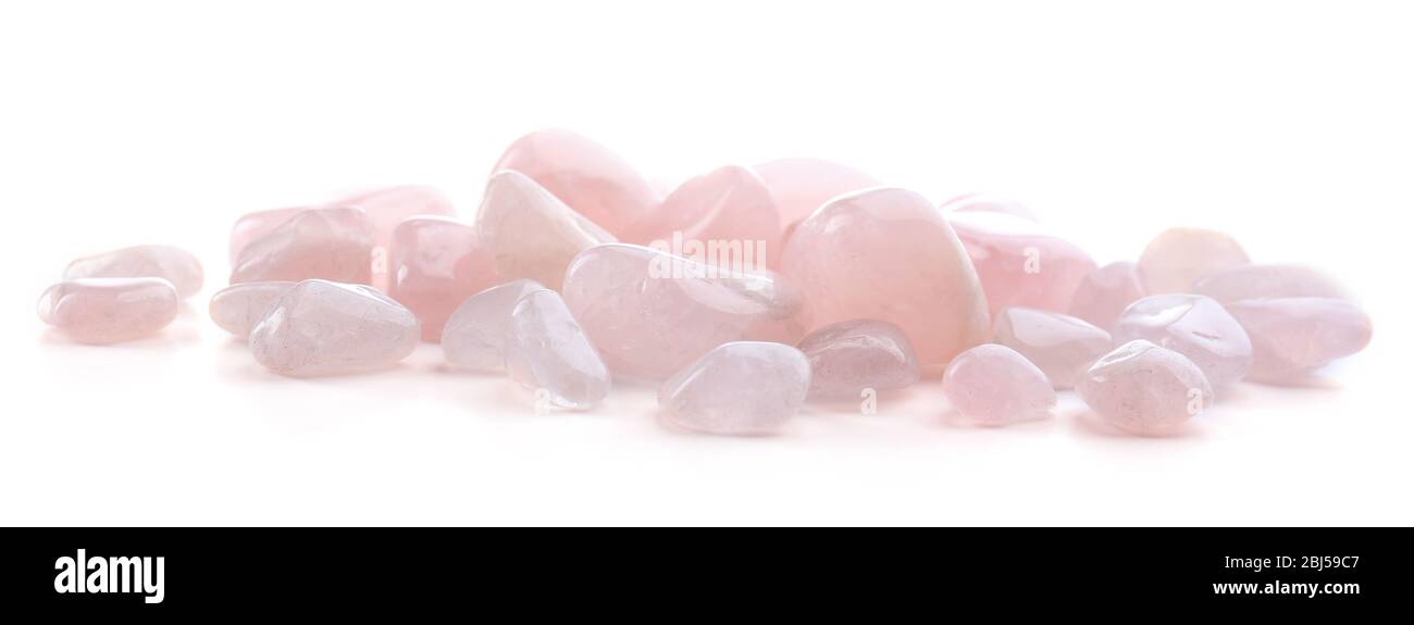 Pink quartz pile isolated on white background Stock Photo - Alamy