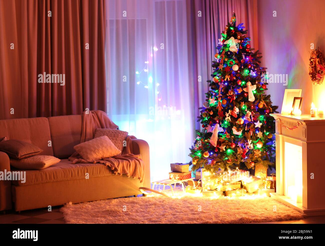 Christmas tree in a room on window background Stock Photo - Alamy