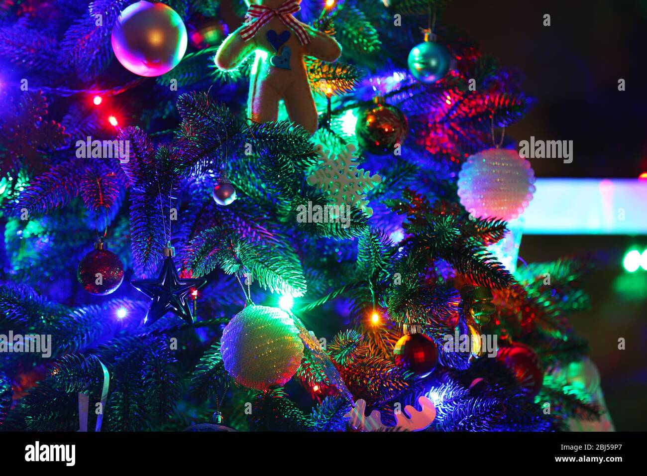 Christmas tree on window background Stock Photo - Alamy