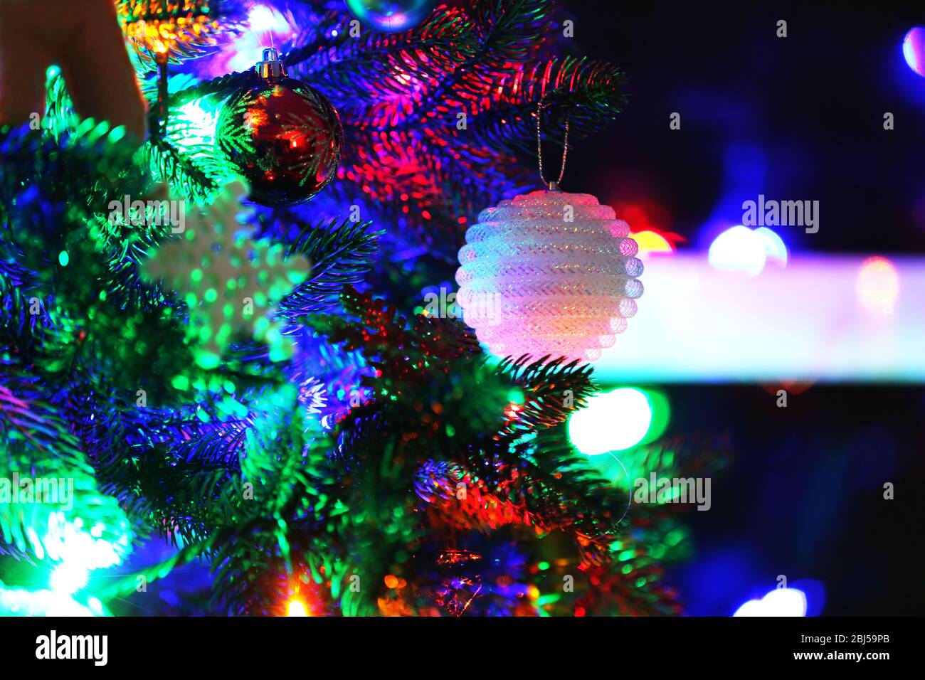 Christmas tree on window background Stock Photo - Alamy