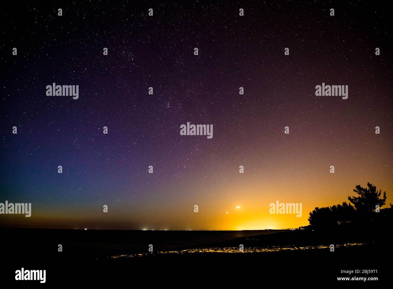 Stars in the sky at night on a beach Stock Photo - Alamy