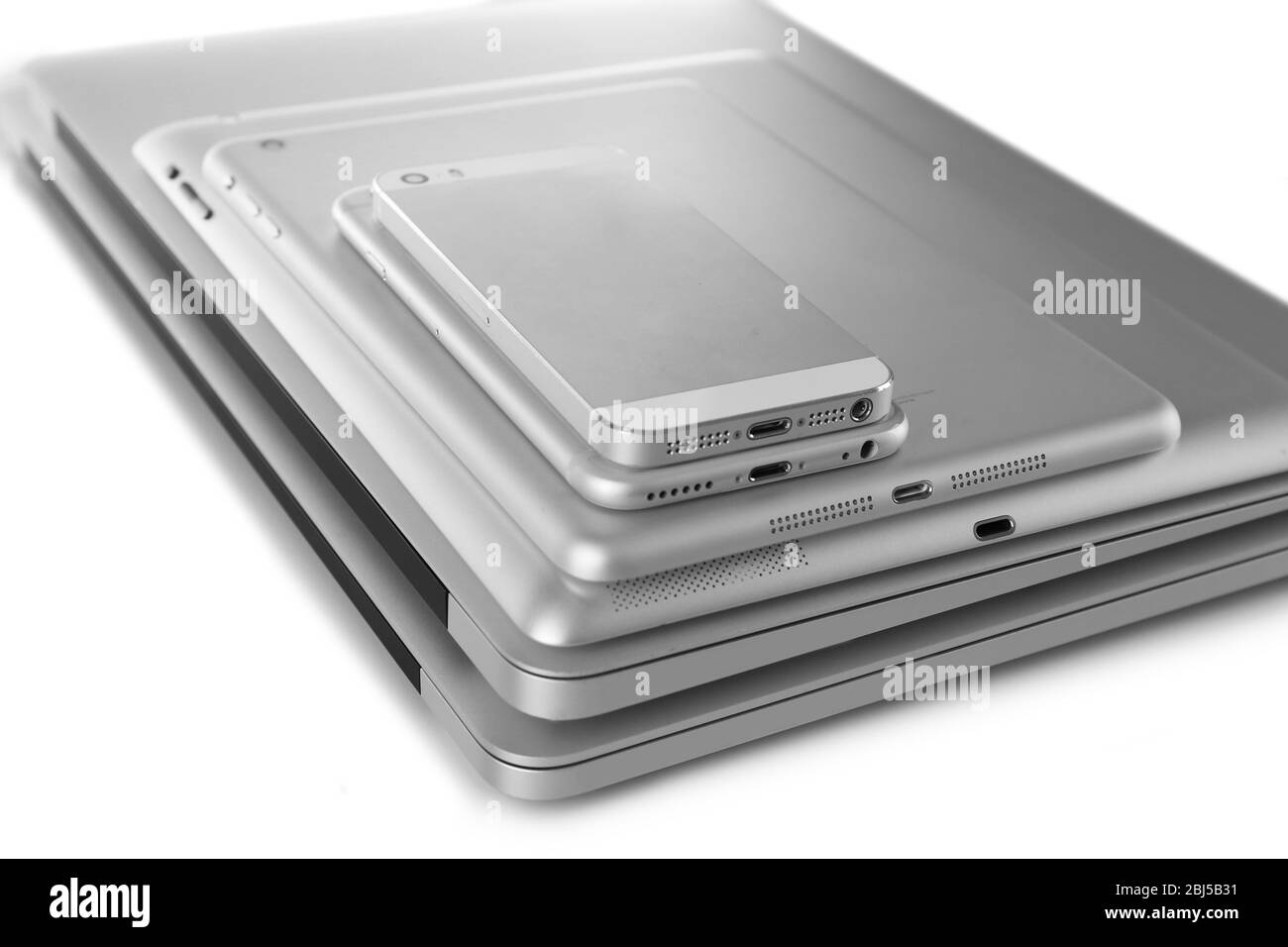 Gadgets on grey background Stock Photo - Alamy