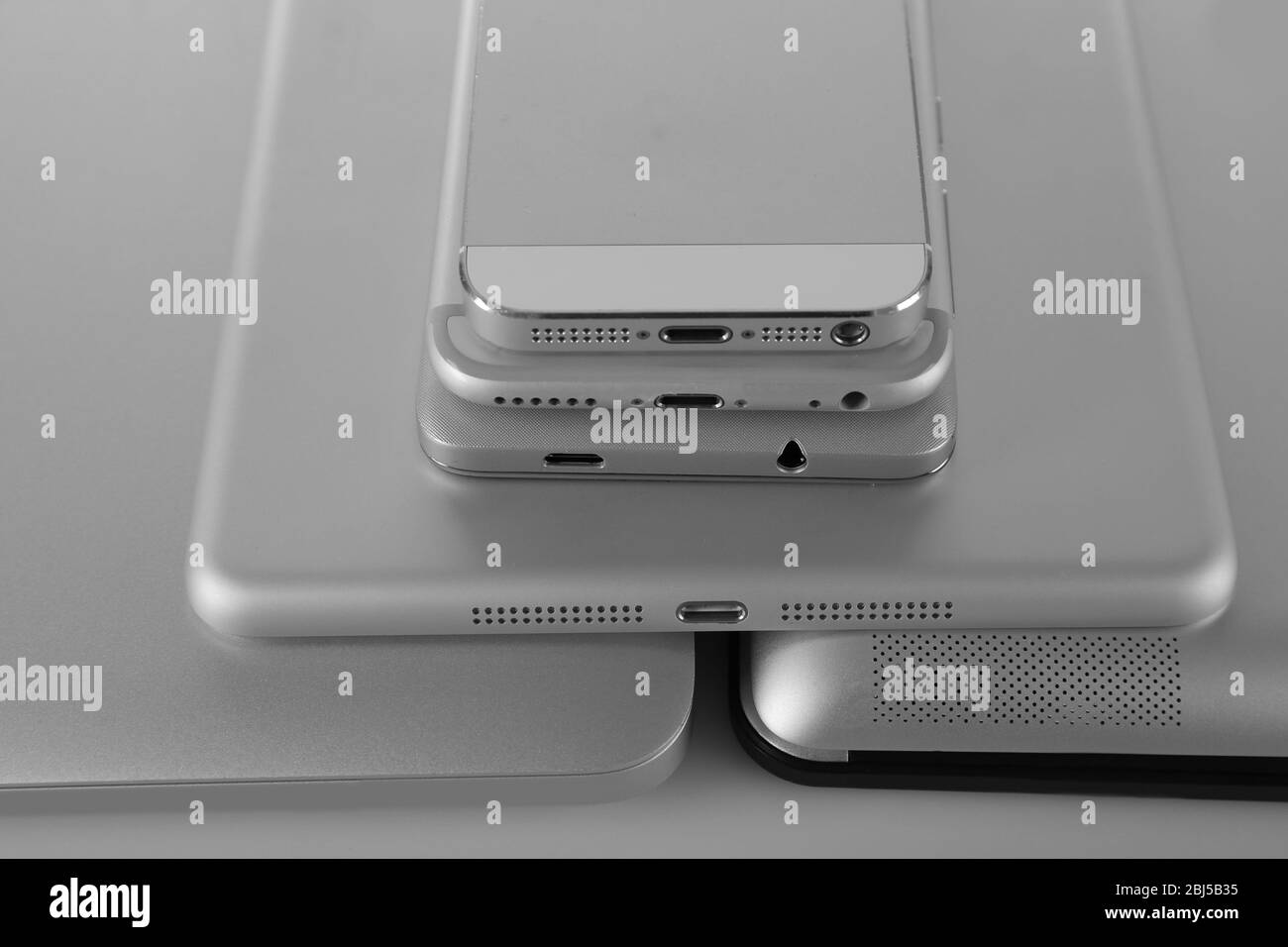 Gadgets on grey background Stock Photo - Alamy