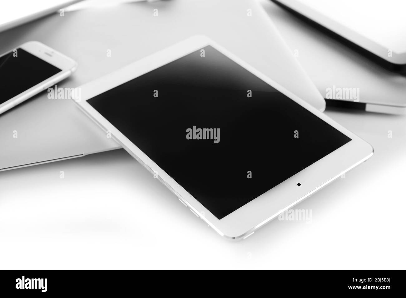 Gadgets on grey background Stock Photo - Alamy