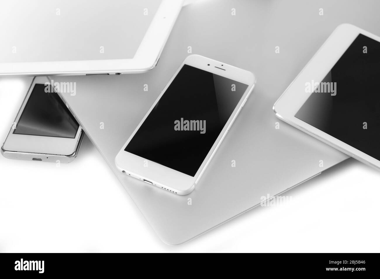 Gadgets on grey background Stock Photo - Alamy