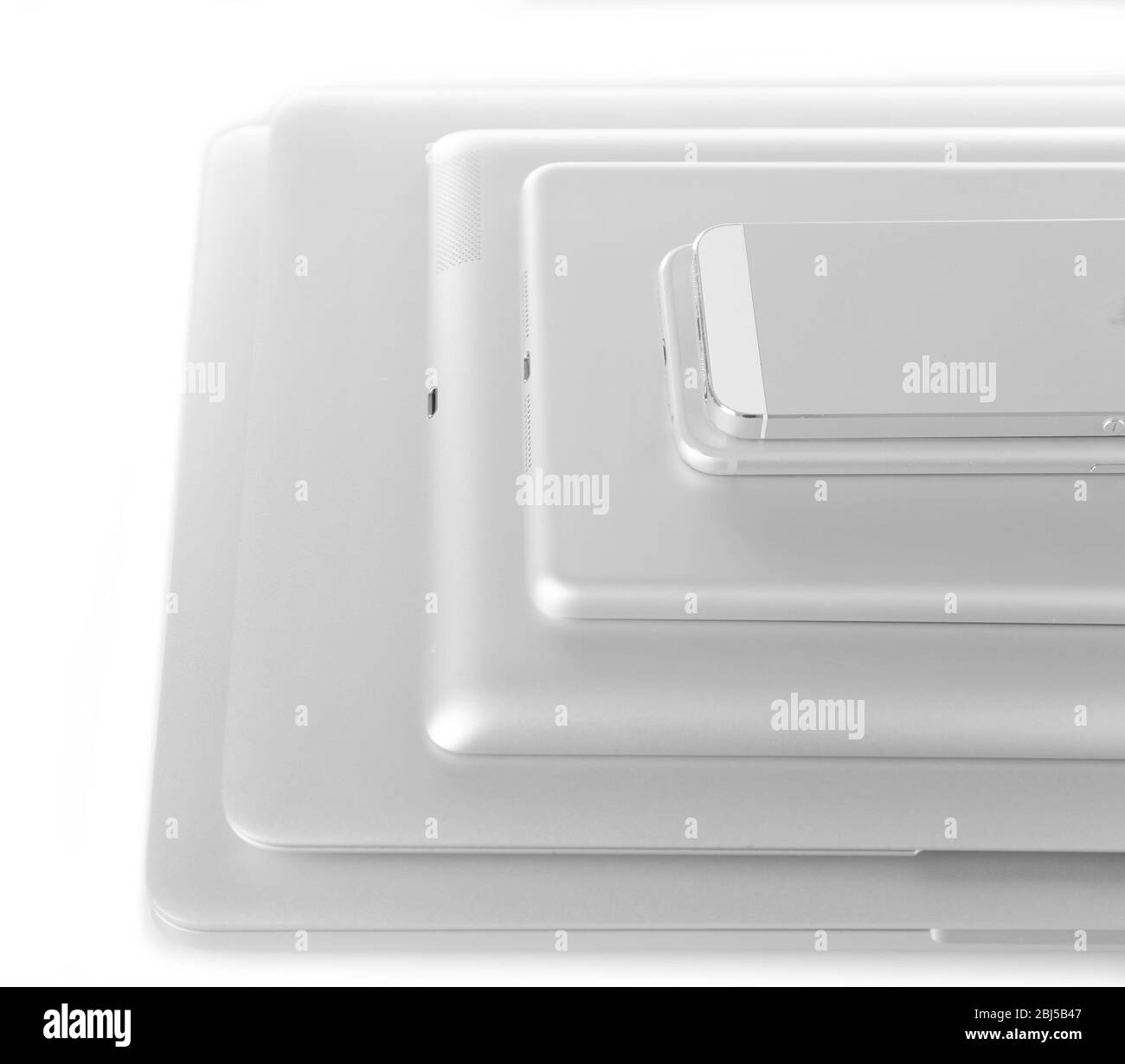 Gadgets on grey background Stock Photo - Alamy