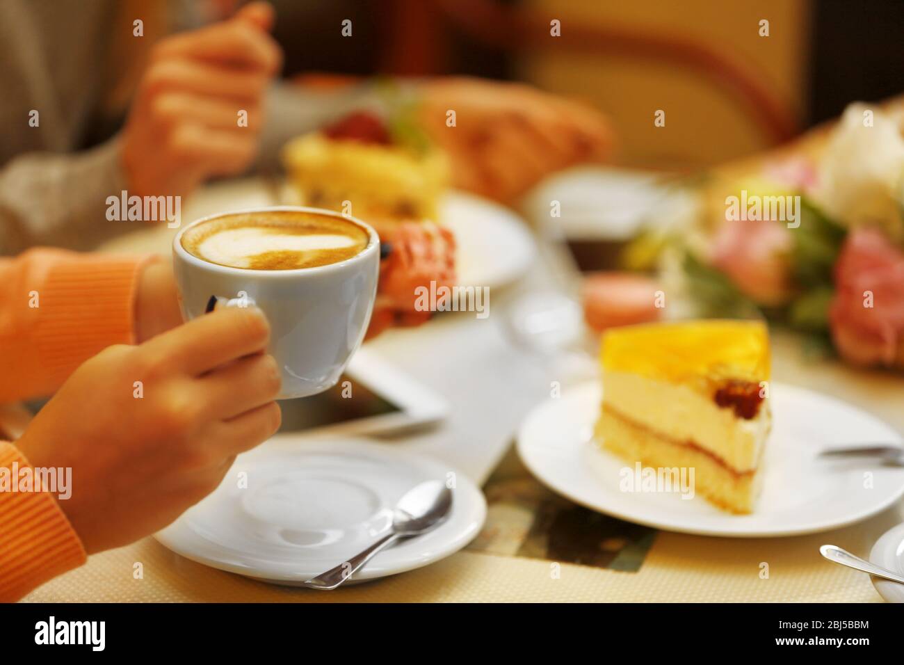 Women eating in cafe hi-res stock photography and images - Alamy