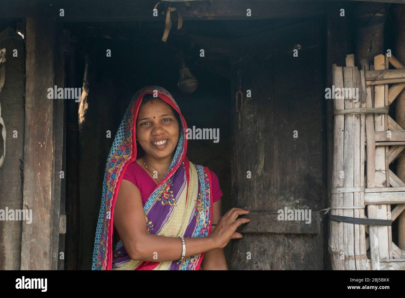 happy rural woman standing at the door Stock Photo - Alamy