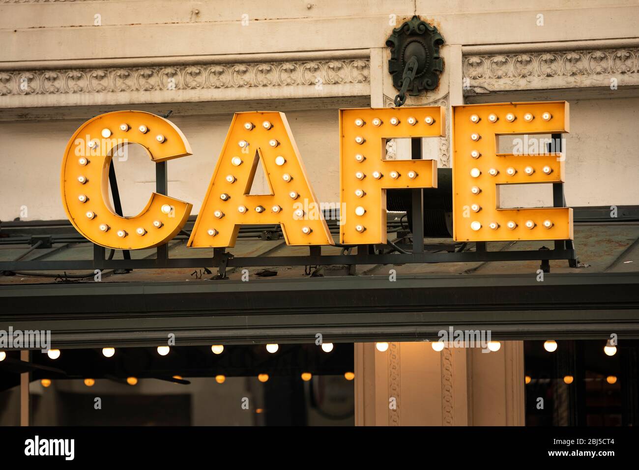 Cafe coffee house illuminated store sign Stock Photo - Alamy
