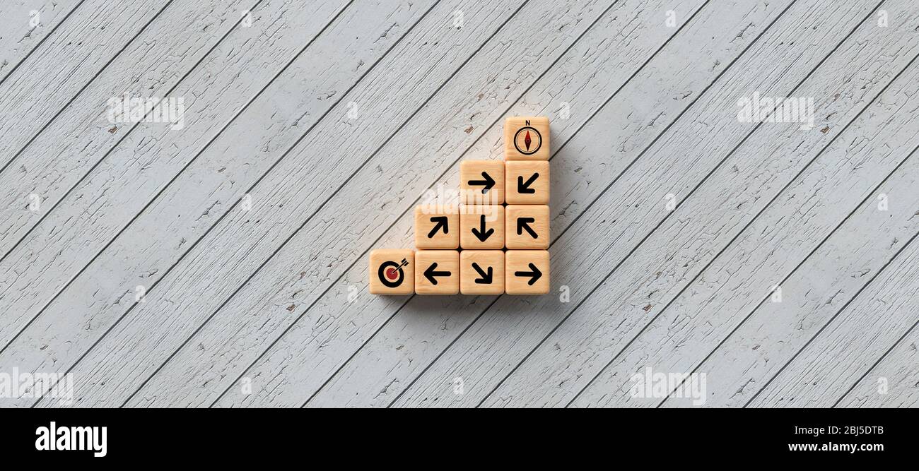 stacked cubes with a compass symbol on top on wooden background - 3D ...