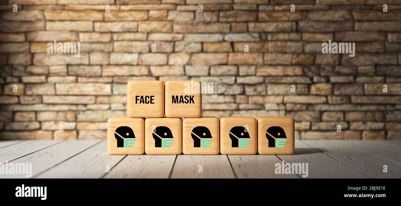 cubes with message FACE MASK in front of a brick wall background - 3D ...