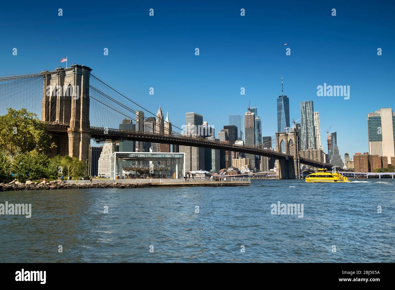 East River shoreline boardwalk under the Brooklyn Bridge as seen from ...