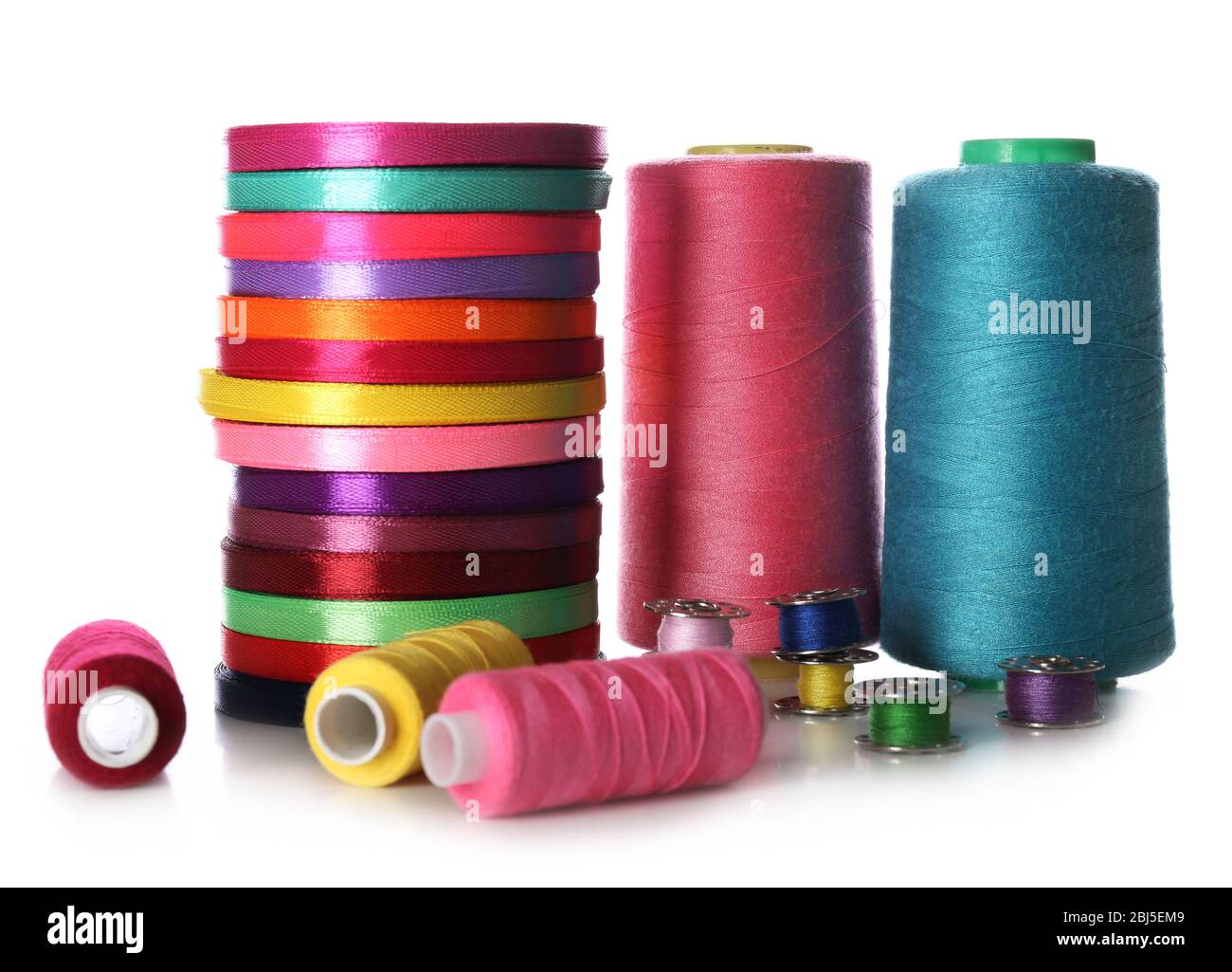 Spools of color ribbon and thread, isolated on white Stock Photo - Alamy