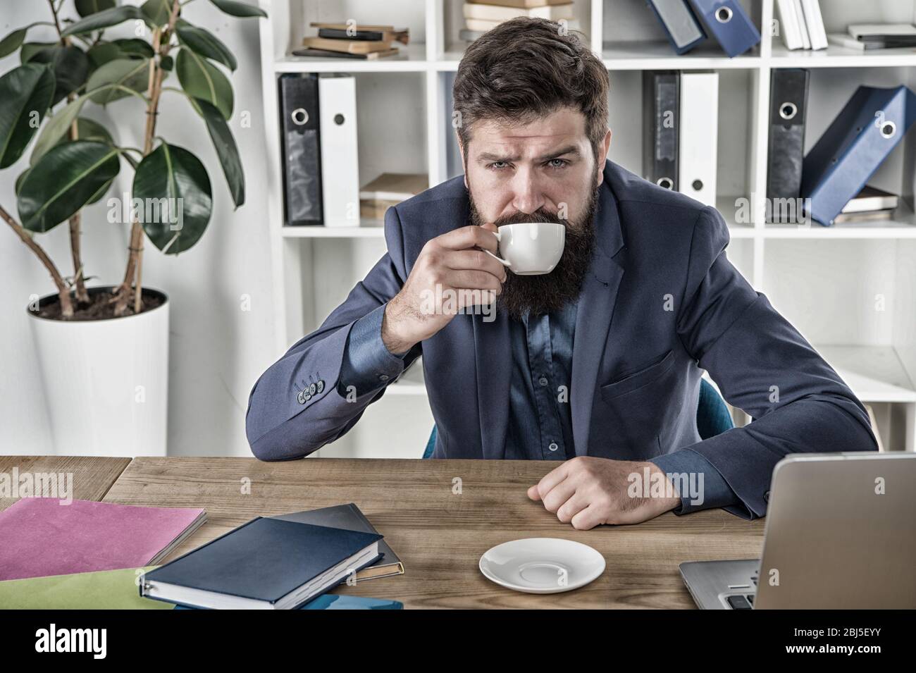 tired man drink coffee. need more energy. early morning drink. modern ...