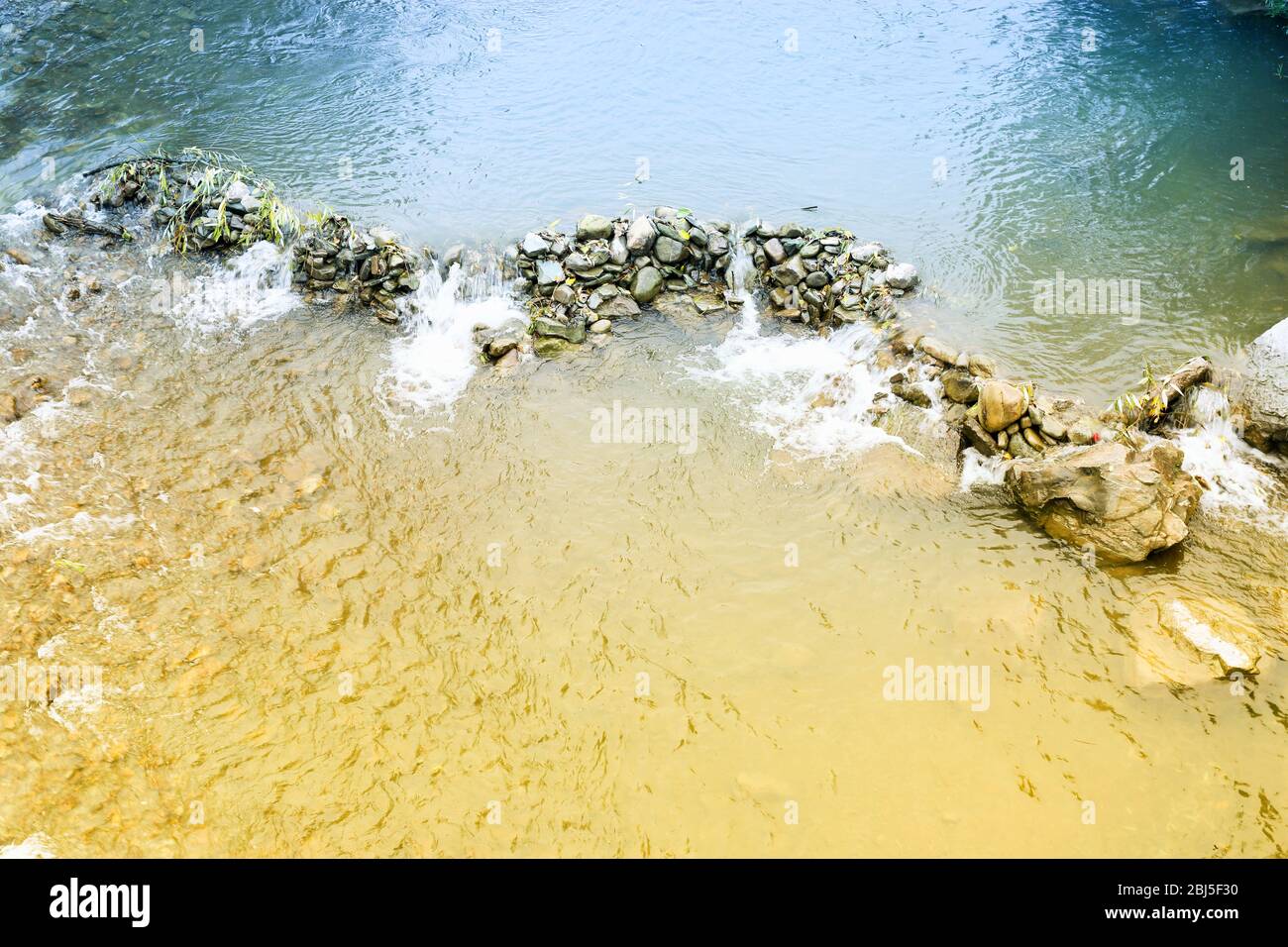 Stones in the river Stock Photo - Alamy