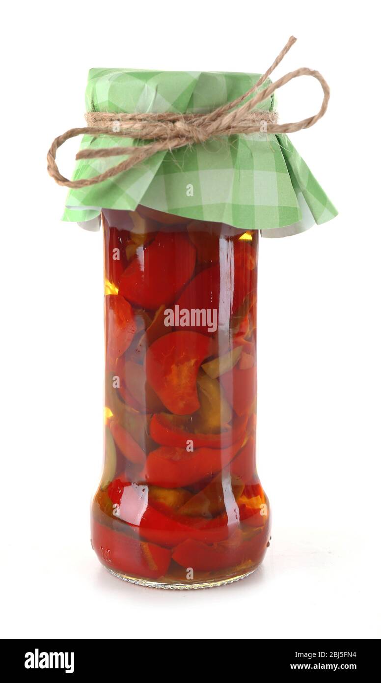 Canned red peppers in glass jar isolated on white Stock Photo - Alamy