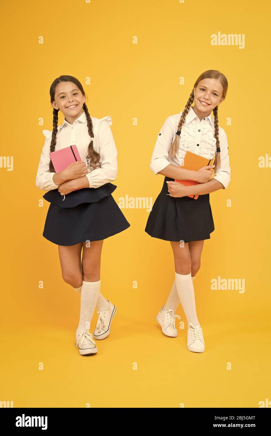 happy girls study with workbook. literature lesson. childrens ...