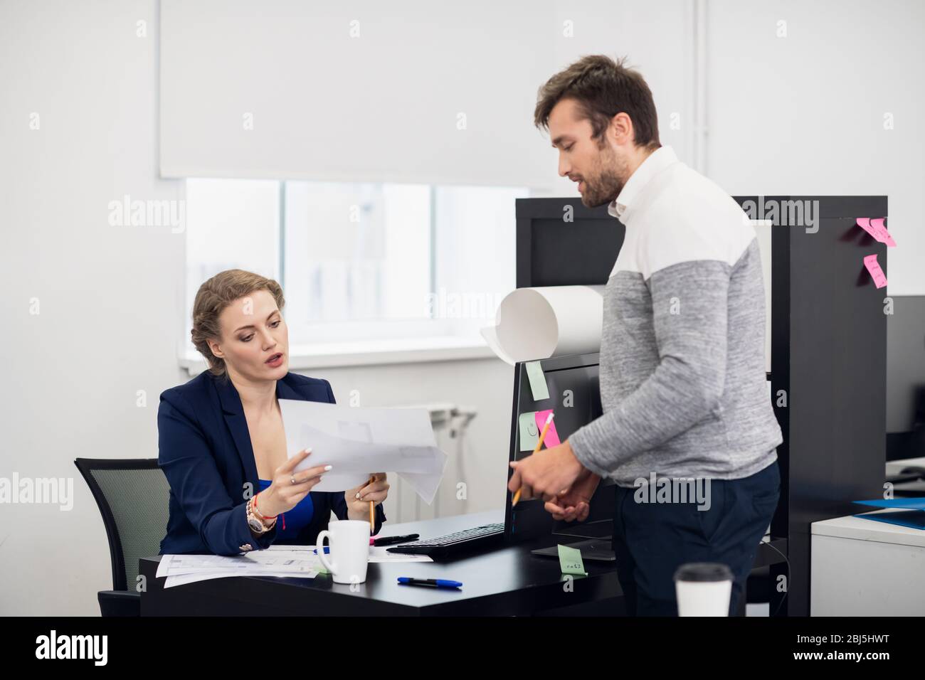 Two successful employees sitting hi-res stock photography and images ...