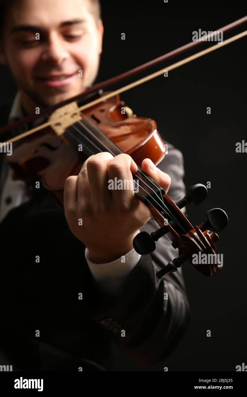 Violinist's performance on black background, close up Stock Photo - Alamy