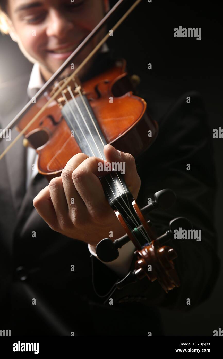 Violinist's performance on black background, close up Stock Photo - Alamy