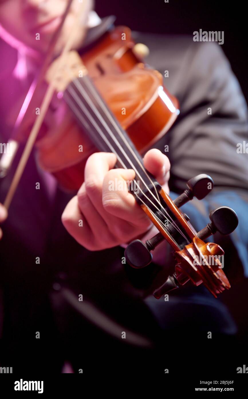 Violinist's performance on black background, close up Stock Photo - Alamy