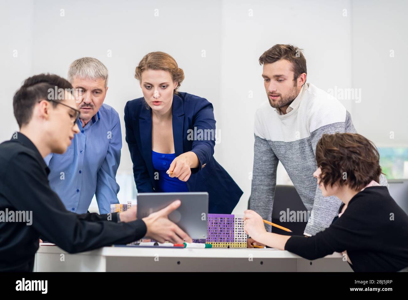 Group of business people brainstorming together in the meeting room ...