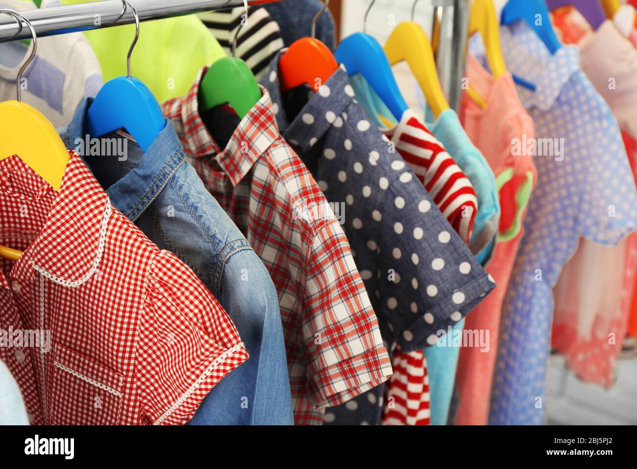 Hangers clothes kids on hi-res stock photography and images - Alamy
