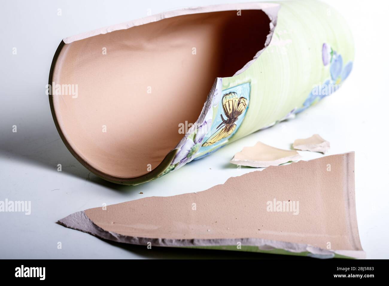 Broken Porcelain Vase Lying on White Background Stock Photo - Alamy