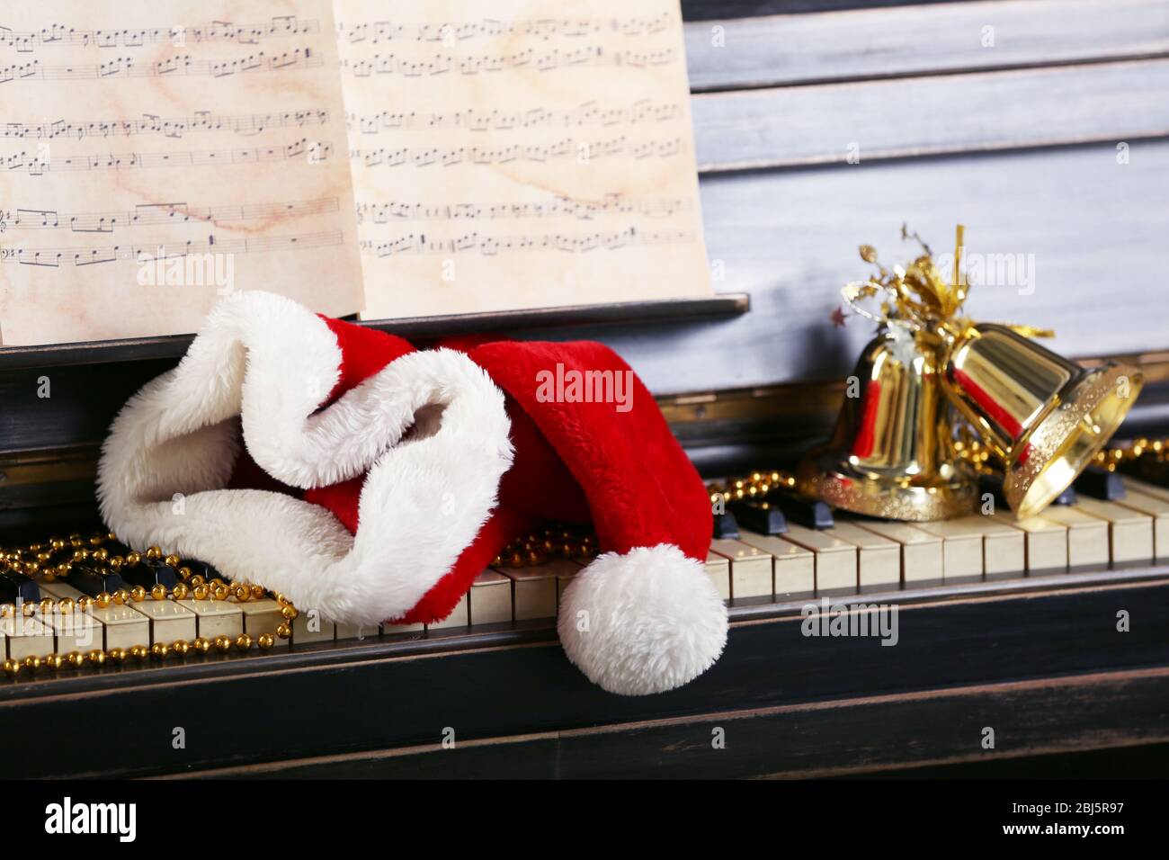 Piano keys decorated with Santa's hat, close up Stock Photo - Alamy