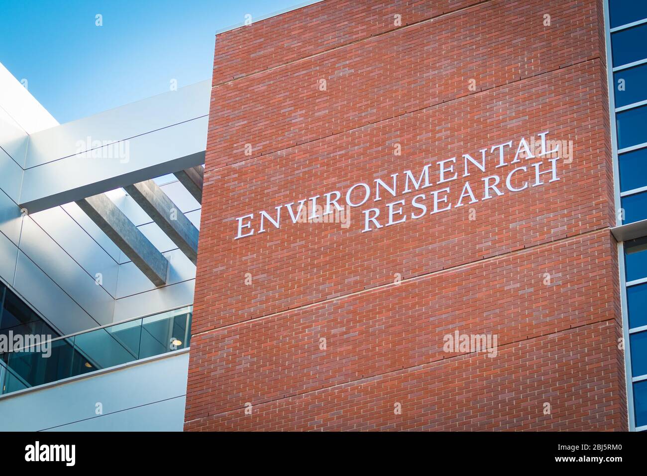 Tall brick building featuring "ENVIRONMENTAL RESEARCH" sign Stock Photo ...