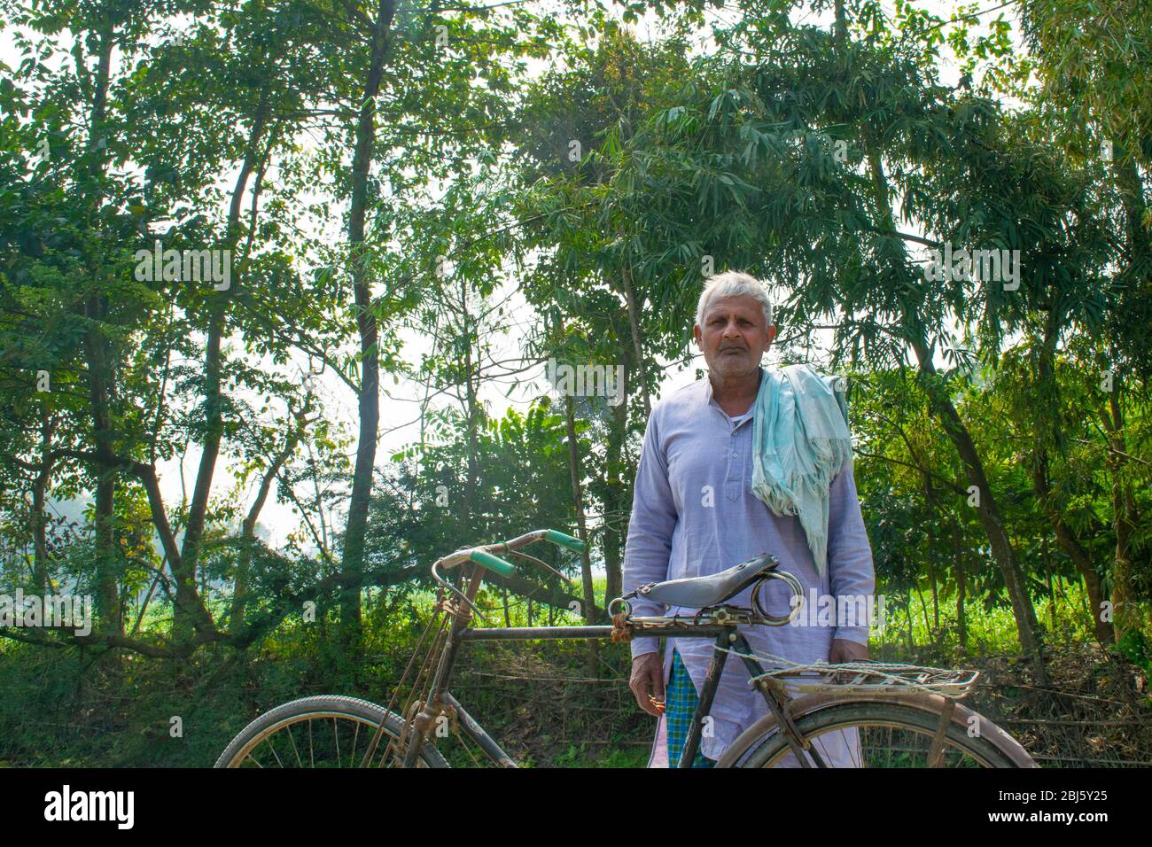farmer with his cycle in rural village, India Stock Photo - Alamy