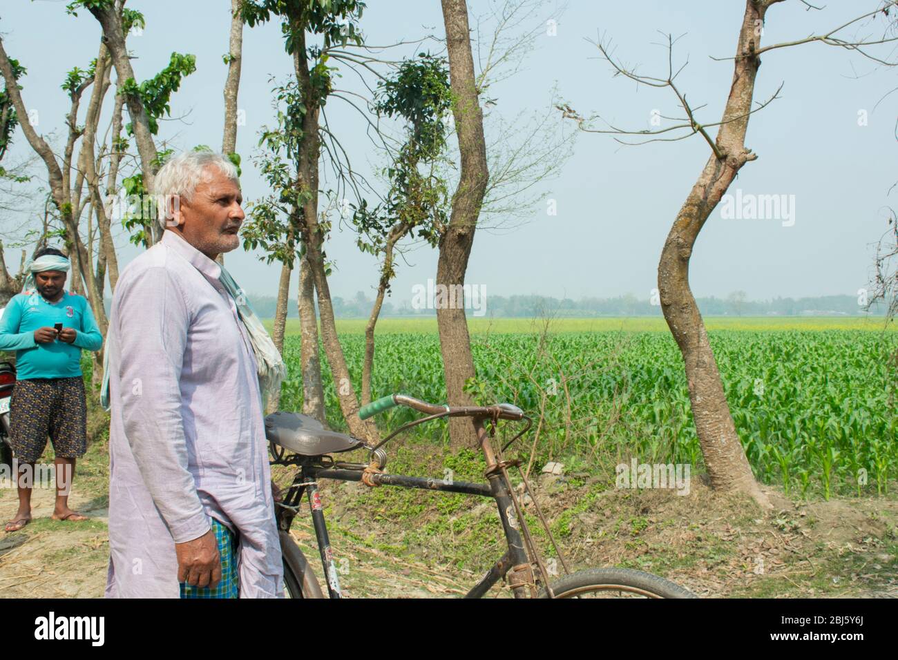 farmer with his cycle in rural village, India Stock Photo - Alamy