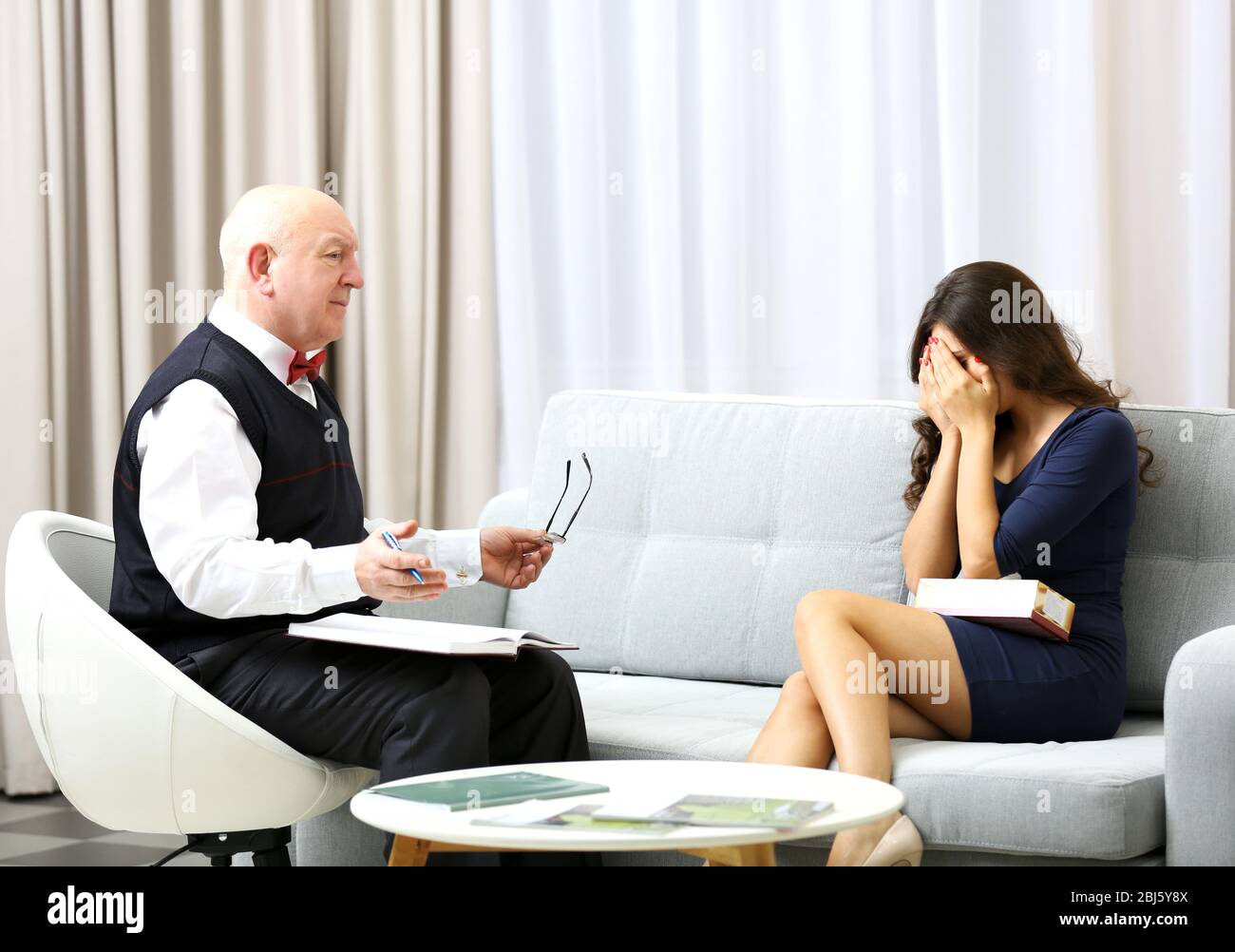 Young woman on reception at psychologist Stock Photo - Alamy