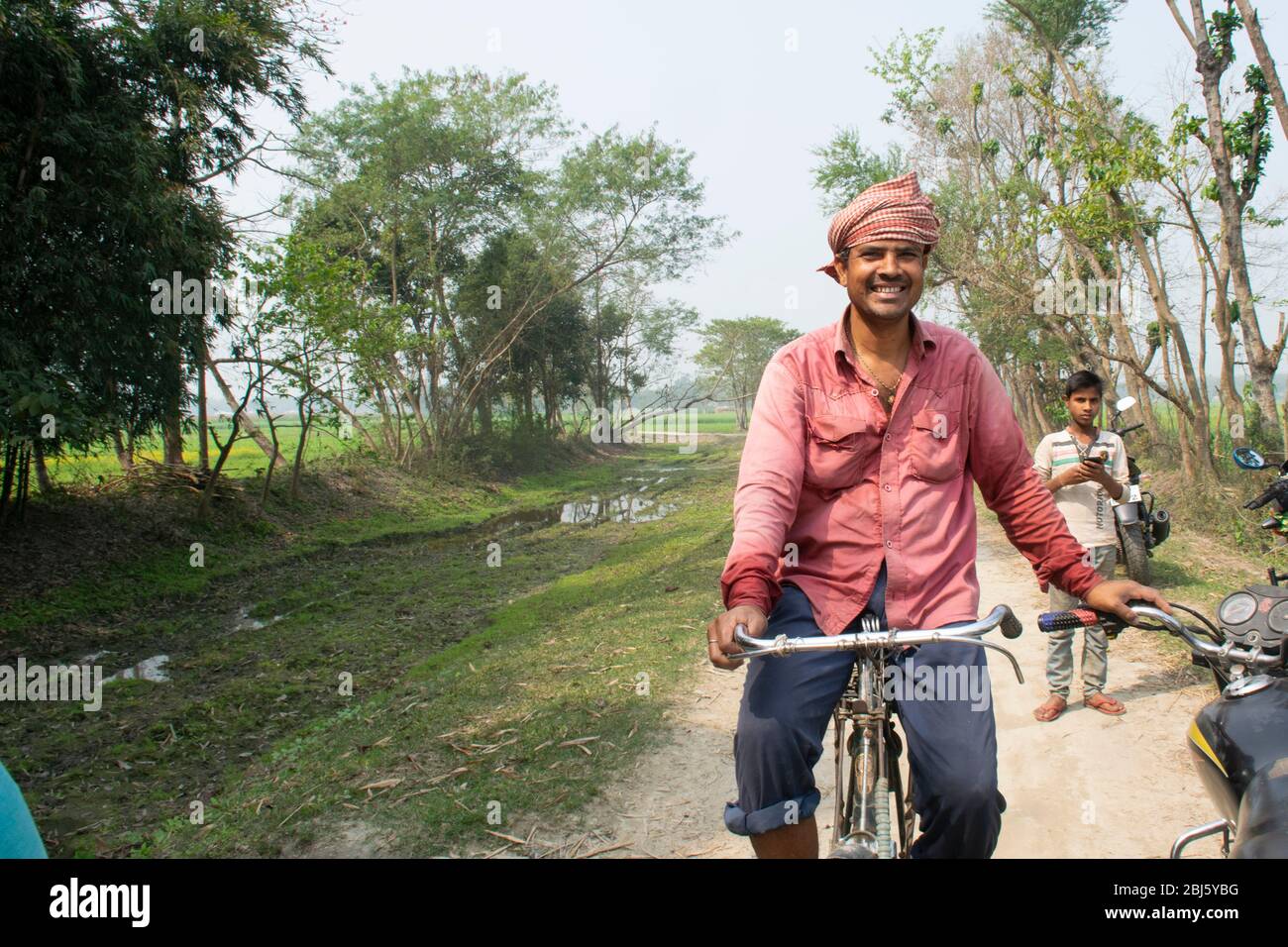 farmer with his cycle in rural village, India Stock Photo - Alamy