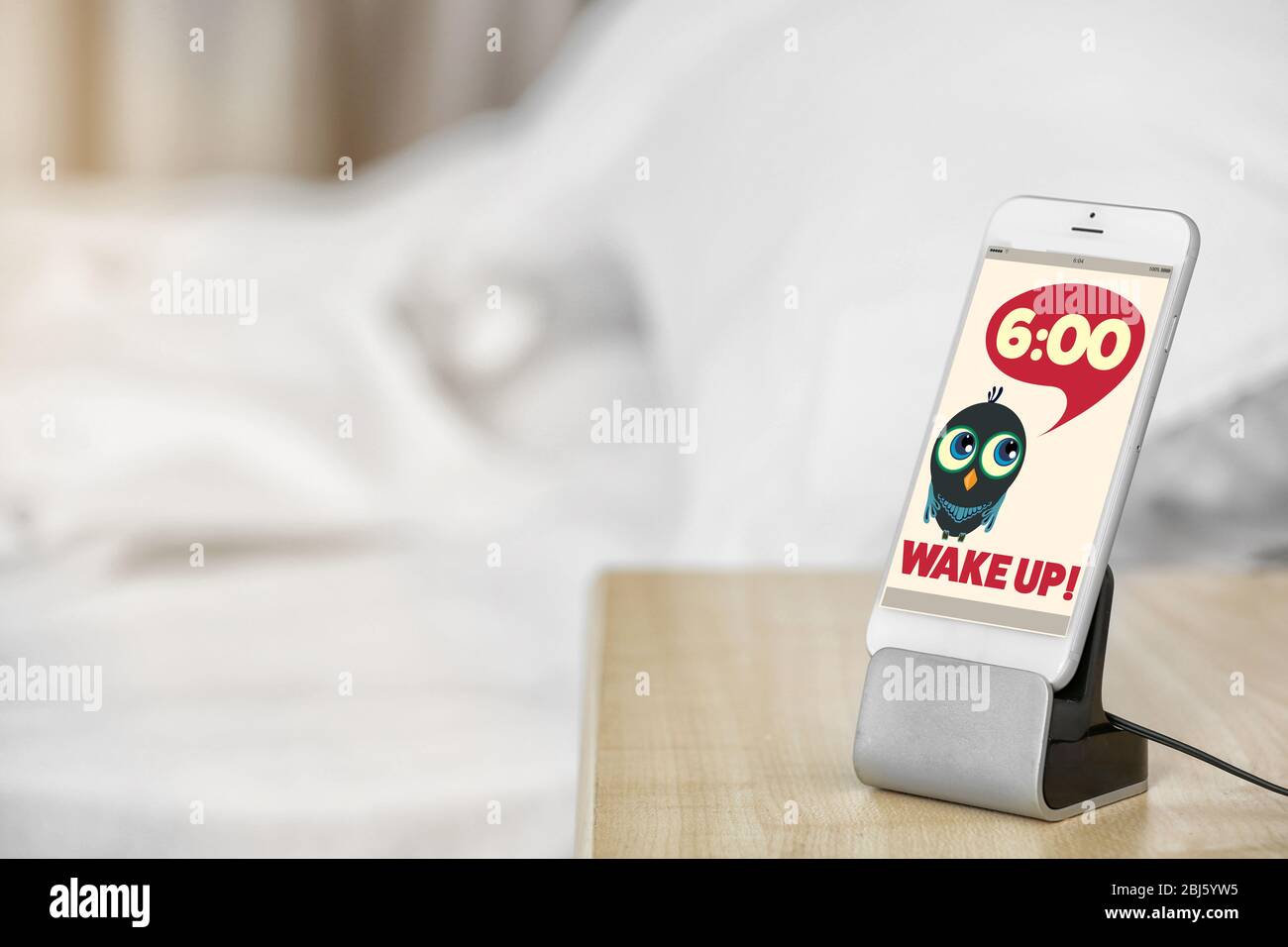 Smart phone on nightstand in bedroom Stock Photo - Alamy