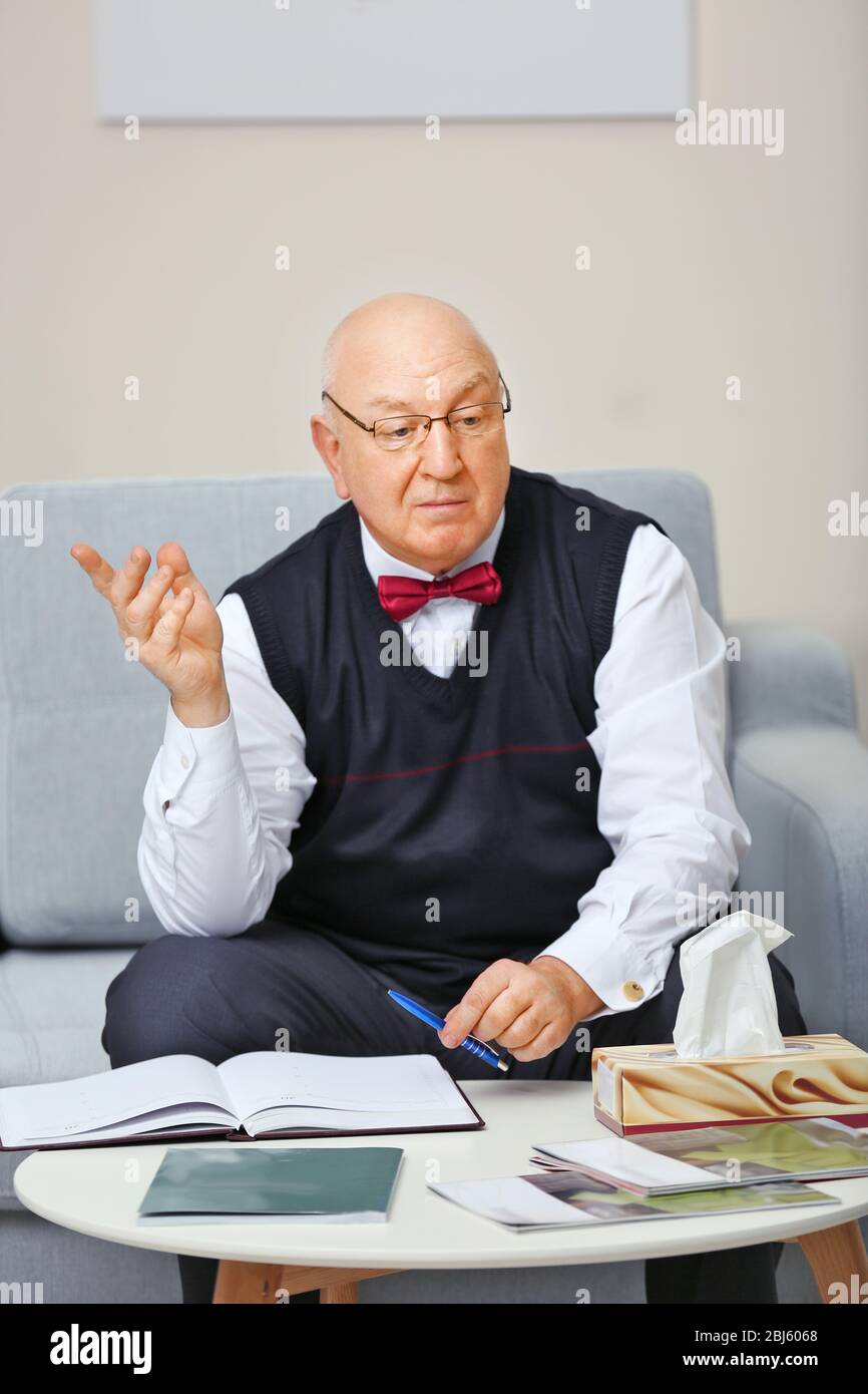 Aged psychologist at work Stock Photo - Alamy