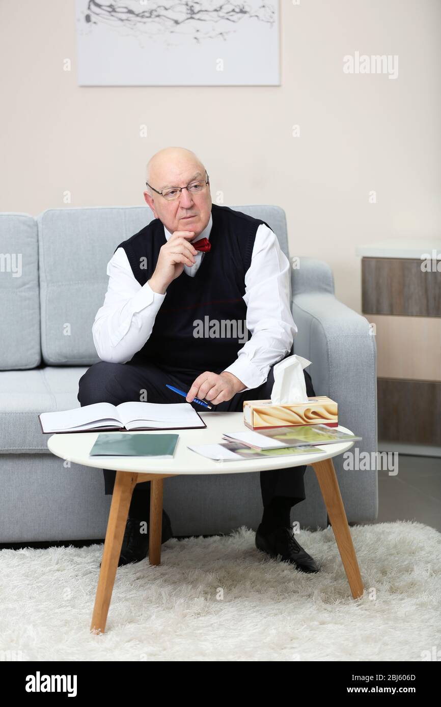 Aged psychologist at work Stock Photo - Alamy