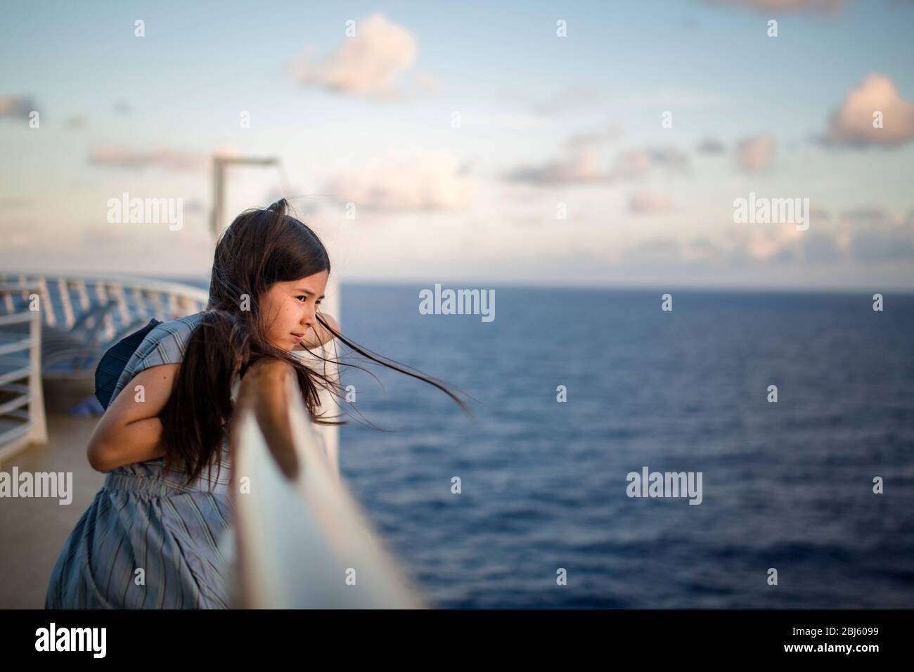 Side view girl ocean sunset hi-res stock photography and images - Alamy