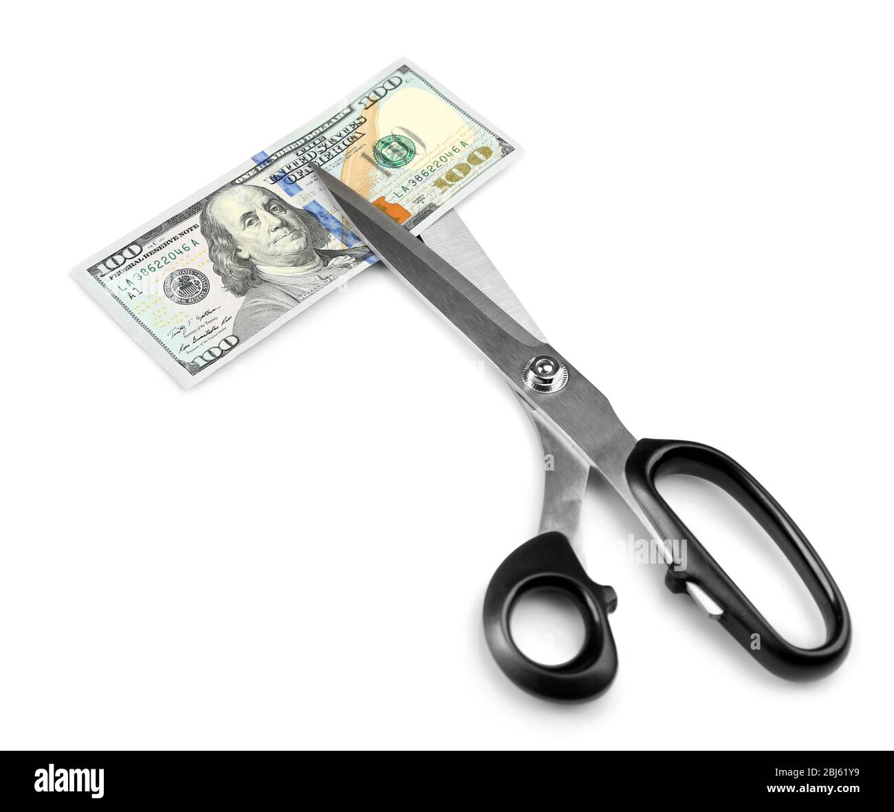 Scissors cut dollar banknote, isolated on white Stock Photo - Alamy
