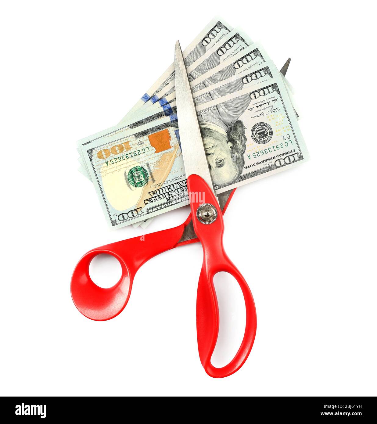 Scissors cut dollar banknotes, isolated on white Stock Photo - Alamy