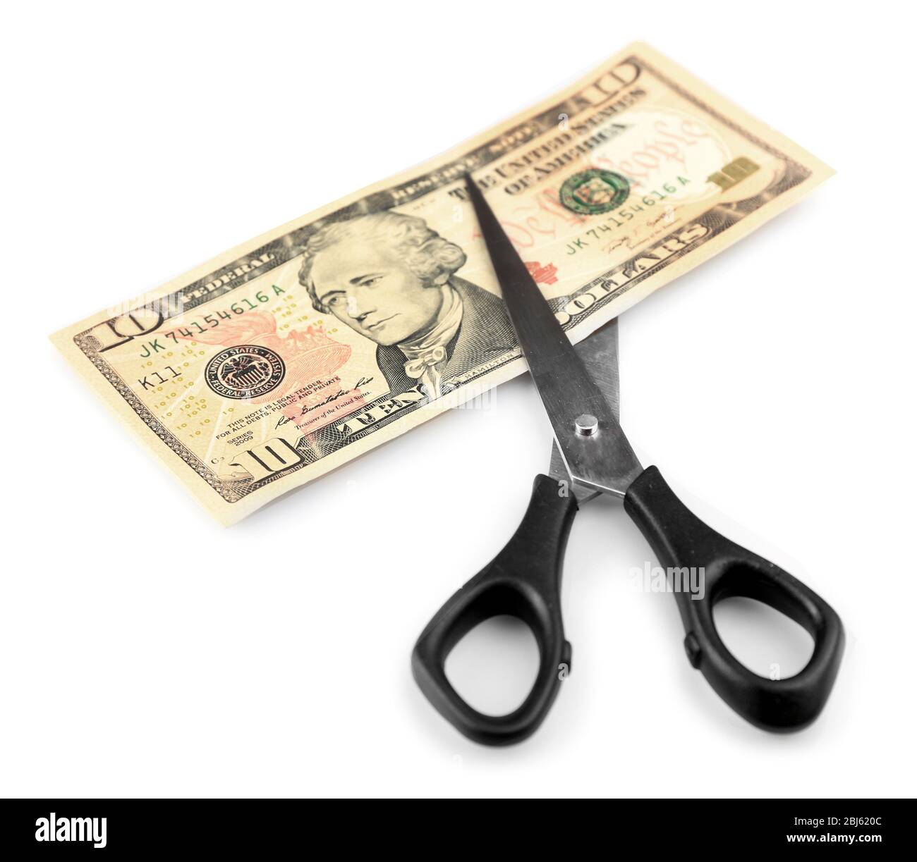 Scissors cut dollar banknote, isolated on white Stock Photo - Alamy