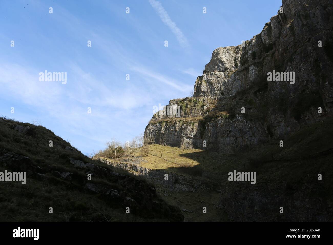 Cheddar Gorge is a limestone gorge in the Mendip Hills , near the ...