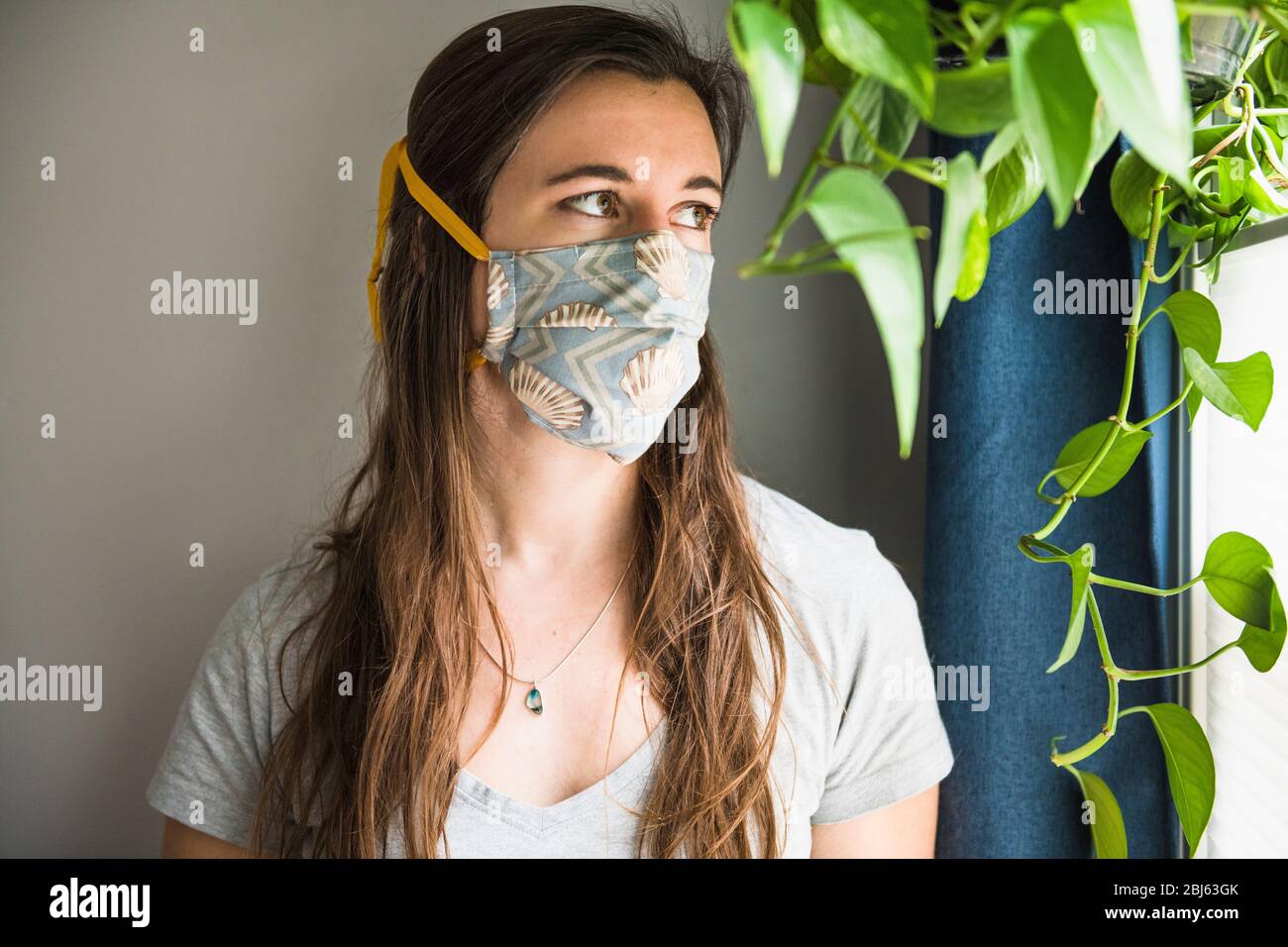 Woman indoors at home with homemade face mask protection PPE Stock ...