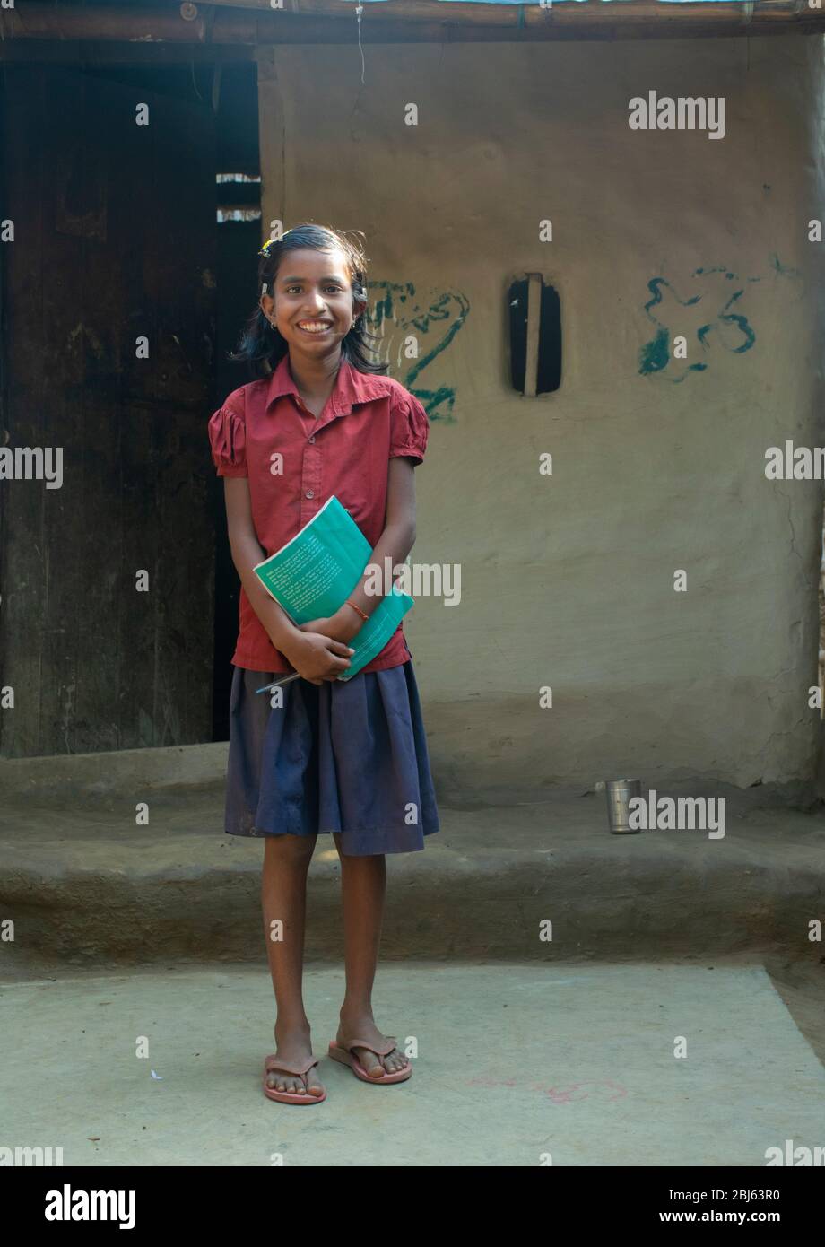rural girl holding books ready for school. India Stock Photo - Alamy