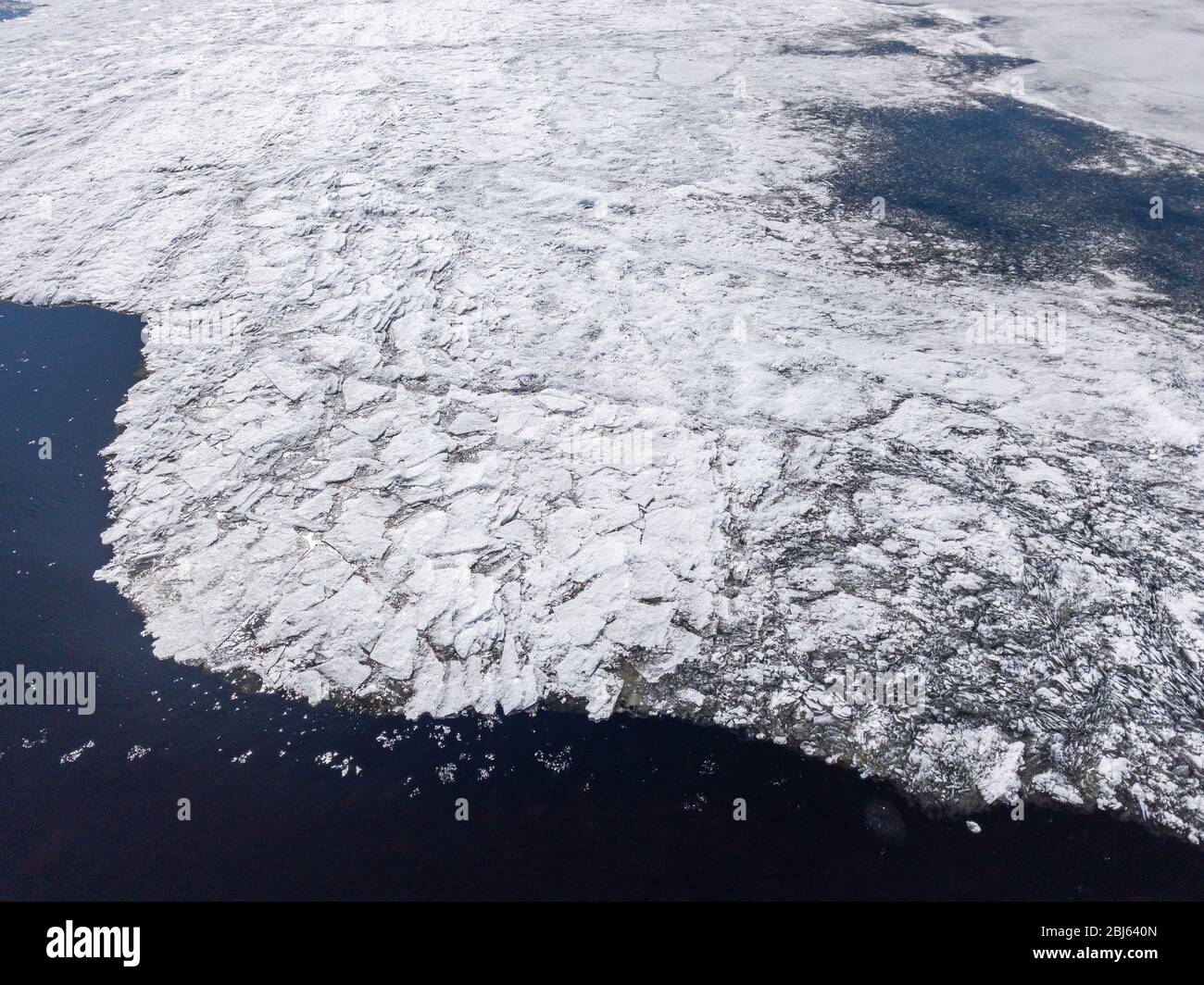 Aerial view of the ice texture broken into pieces of different shapes ...